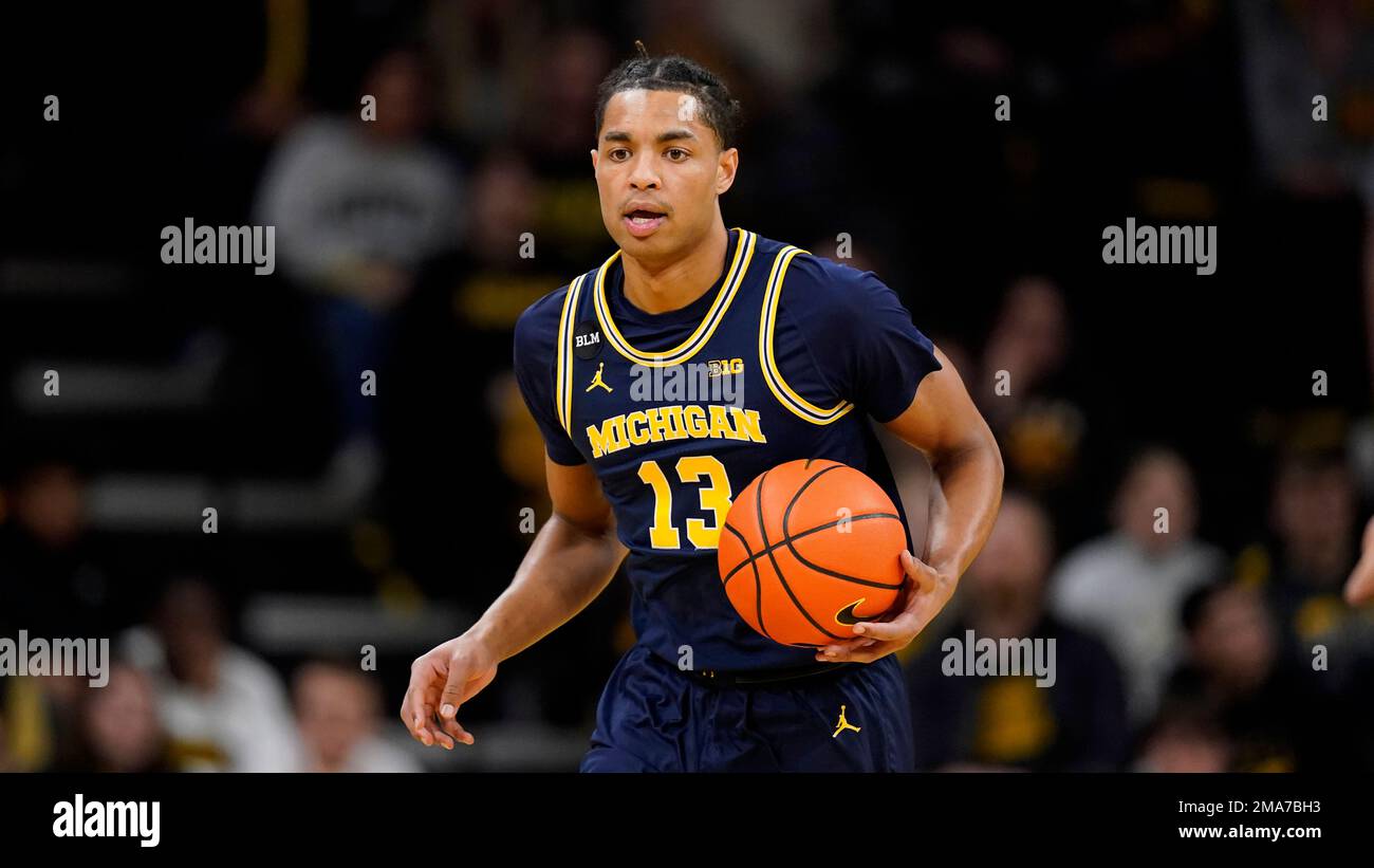 Michigan guard Jett Howard drives up court during an NCAA college ...