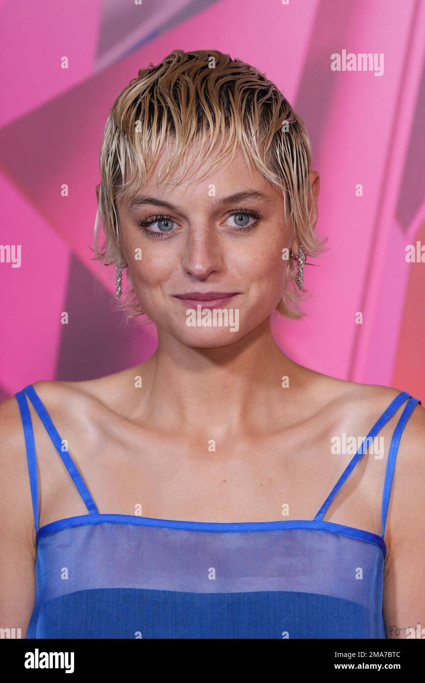 Emma Corrin poses for photographers upon arrival for the premiere of ...
