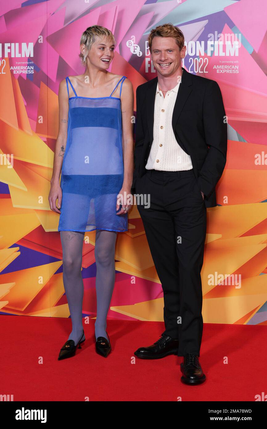 Emma Corrin, left, and Jack O'Connell pose for photographers upon ...