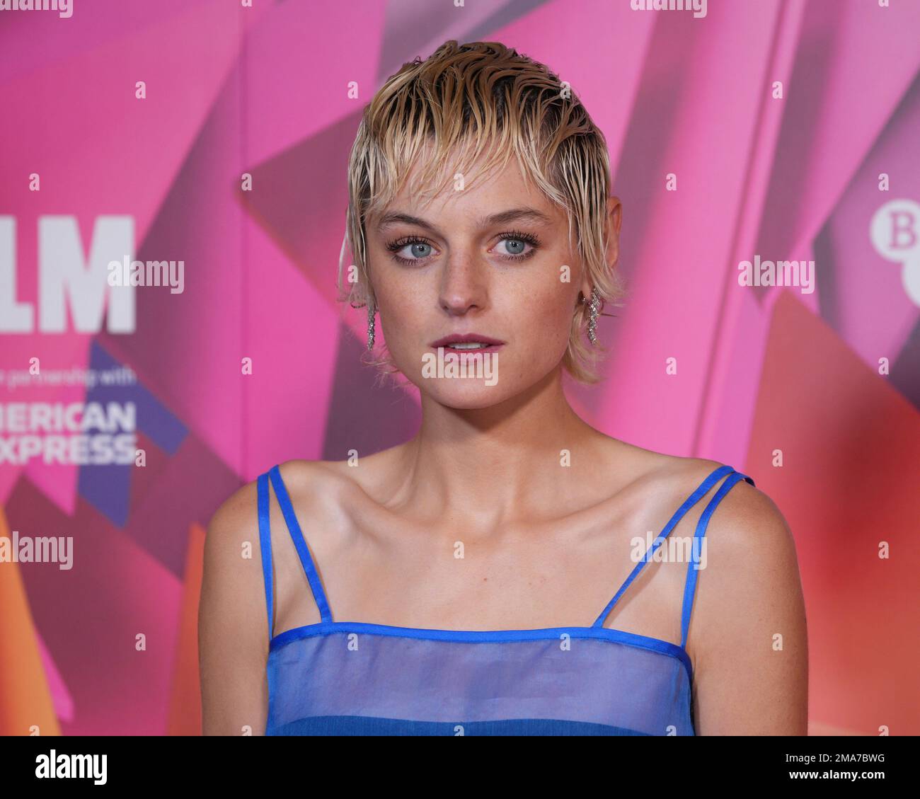 Emma Corrin poses for photographers upon arrival for the premiere of ...