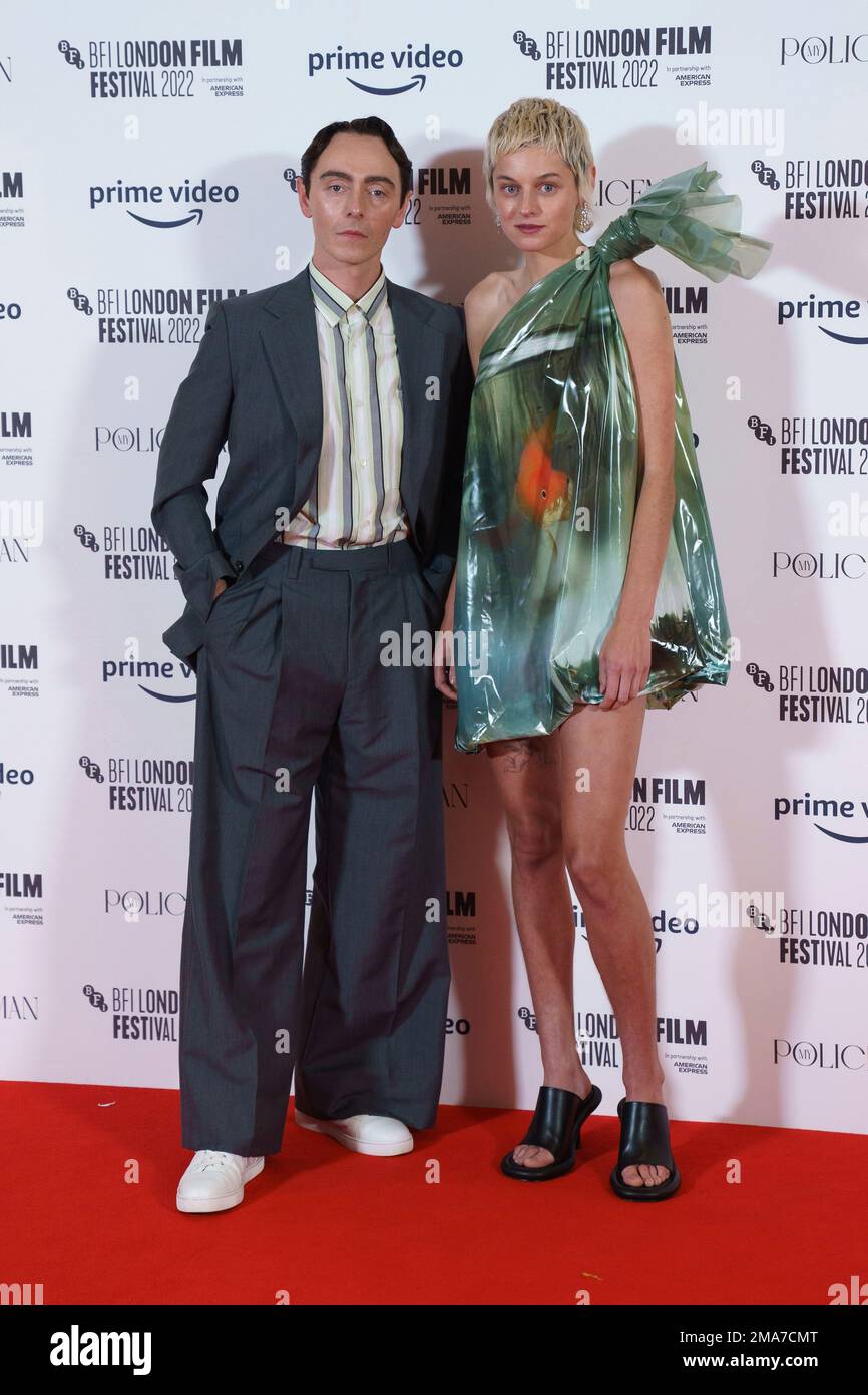 David Dawson, left, and Emma Corrin pose for photographers upon arrival ...