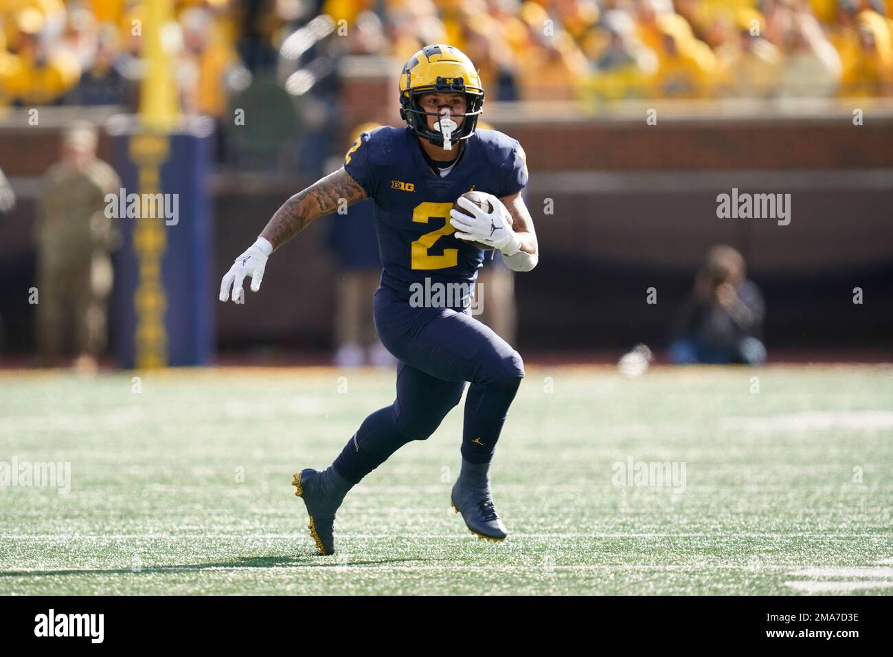 Michigan running back Blake Corum (2) runs against Penn State in the second half of an NCAA ...
