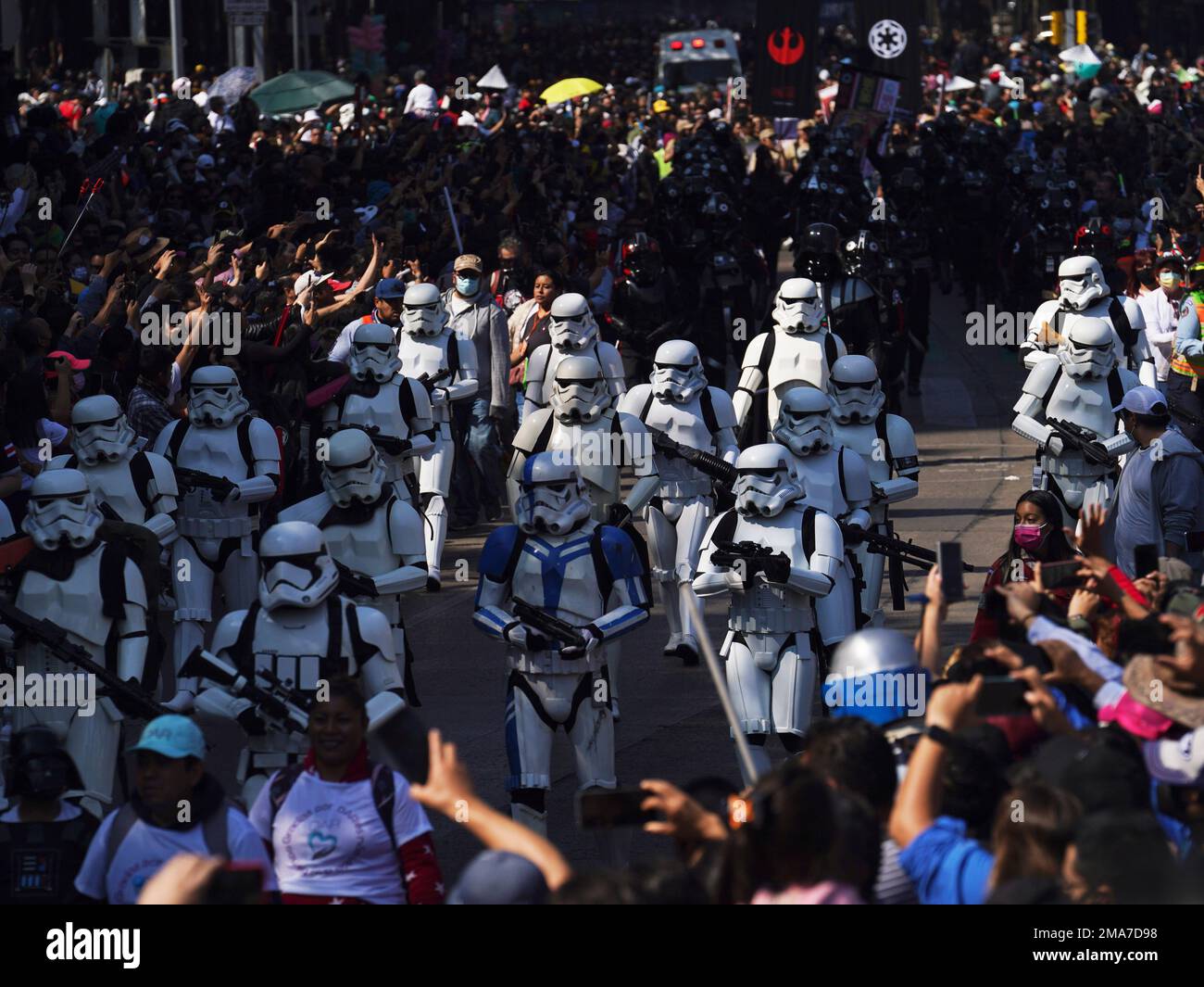 Fans participate in a parade dressed as stormtroopers from the Star ...