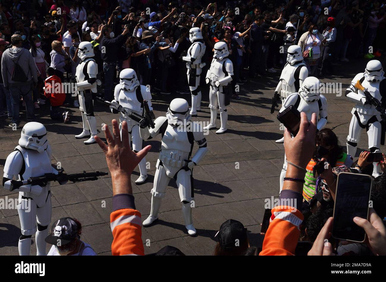 Fans participate in a parade dressed as stormtroopers from the Star ...