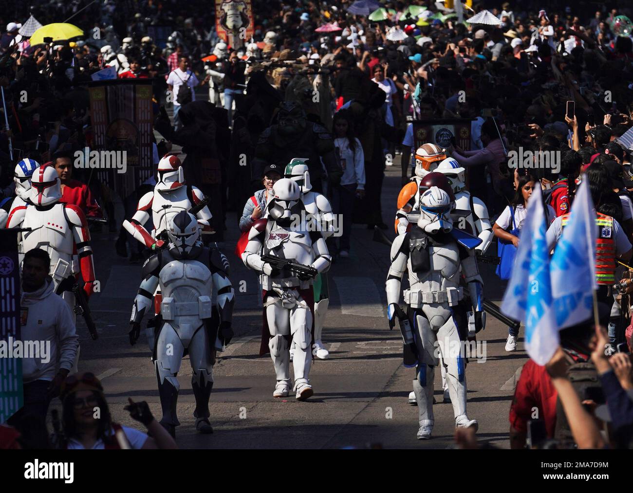 Fans participate in a parade dressed as stormtroopers from the Star ...