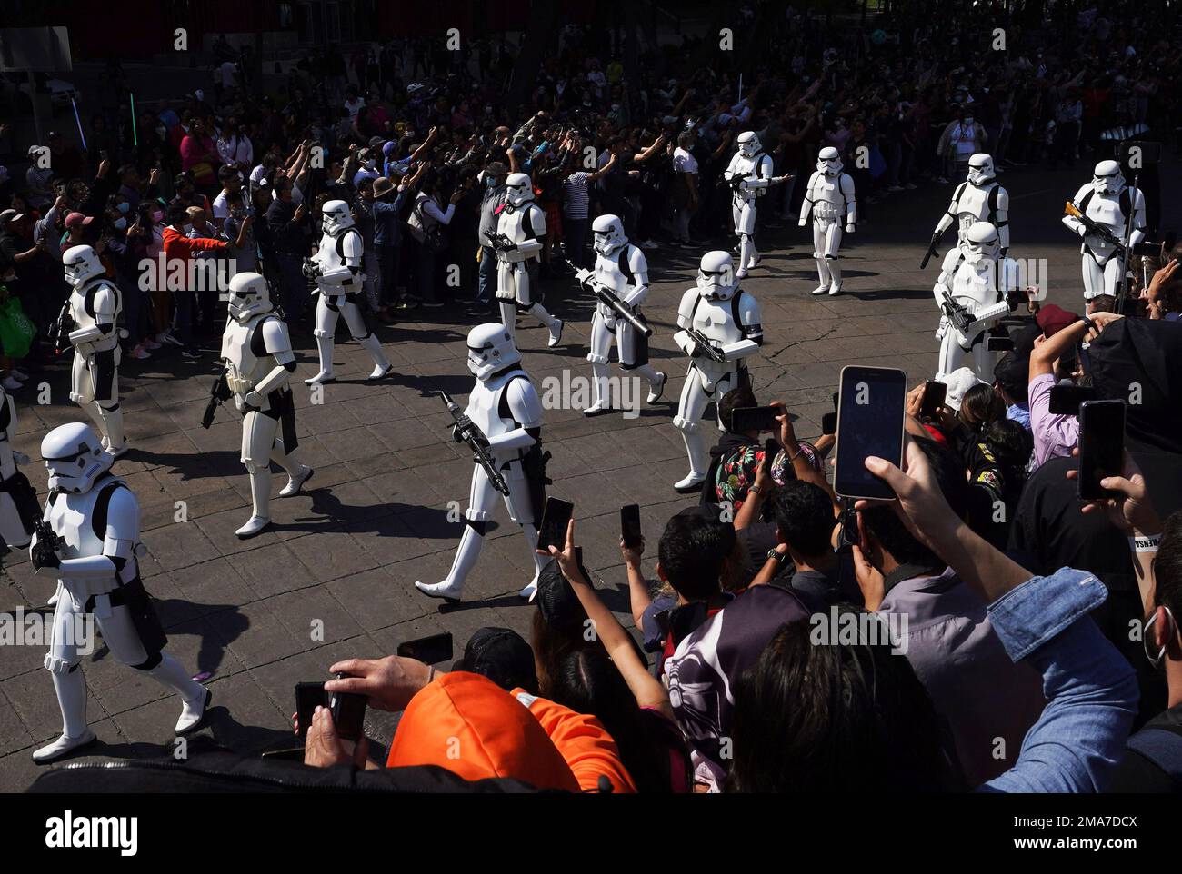 Fans participate in a parade dressed as stormtroopers from the Star ...