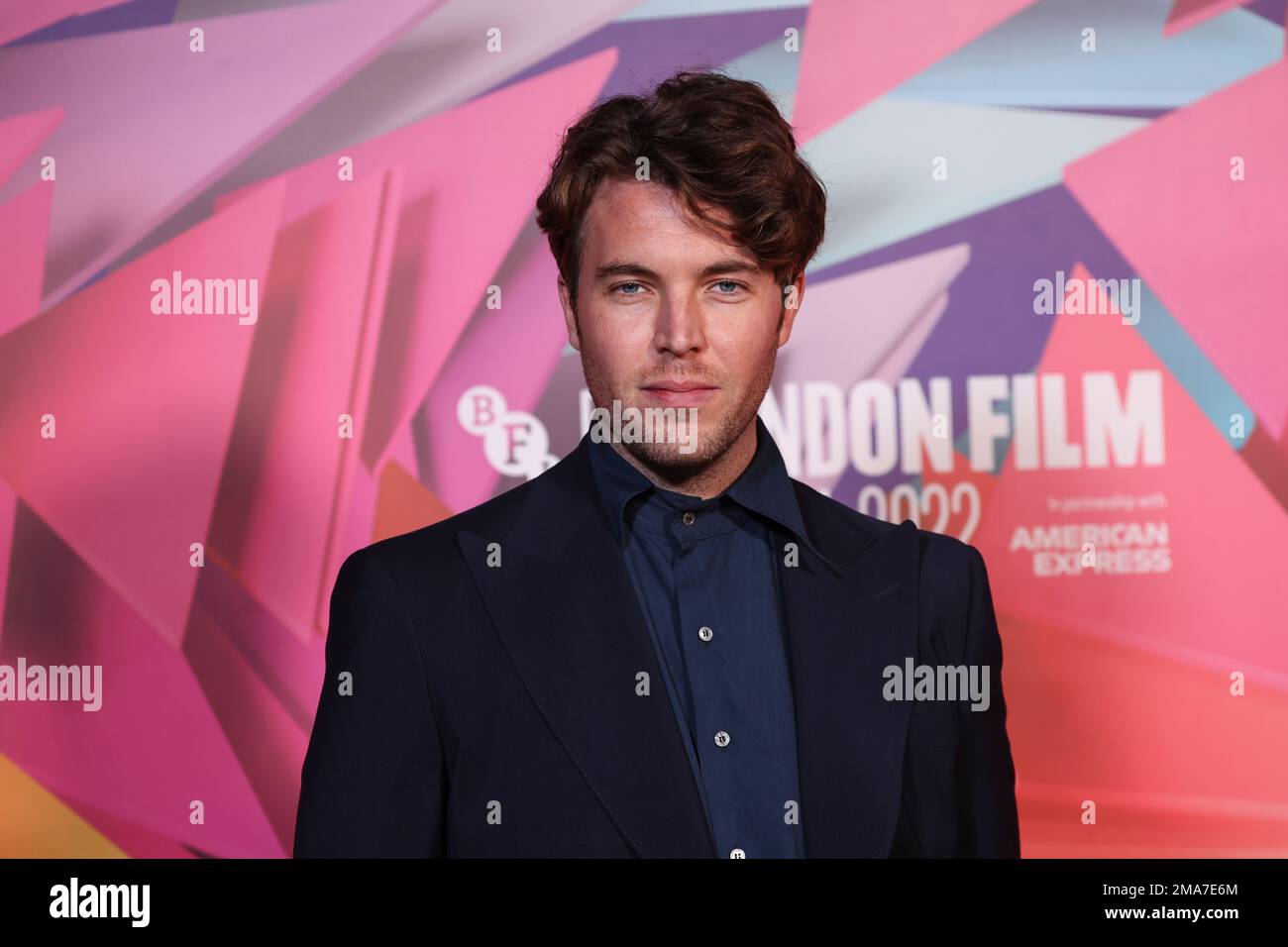 Tom Hughes poses for photographers upon arrival for the premiere of the ...