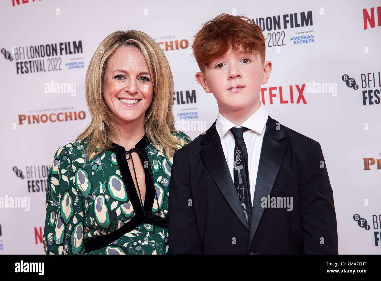 Julian Mann and her son Gregory Mann pose for photographers upon ...