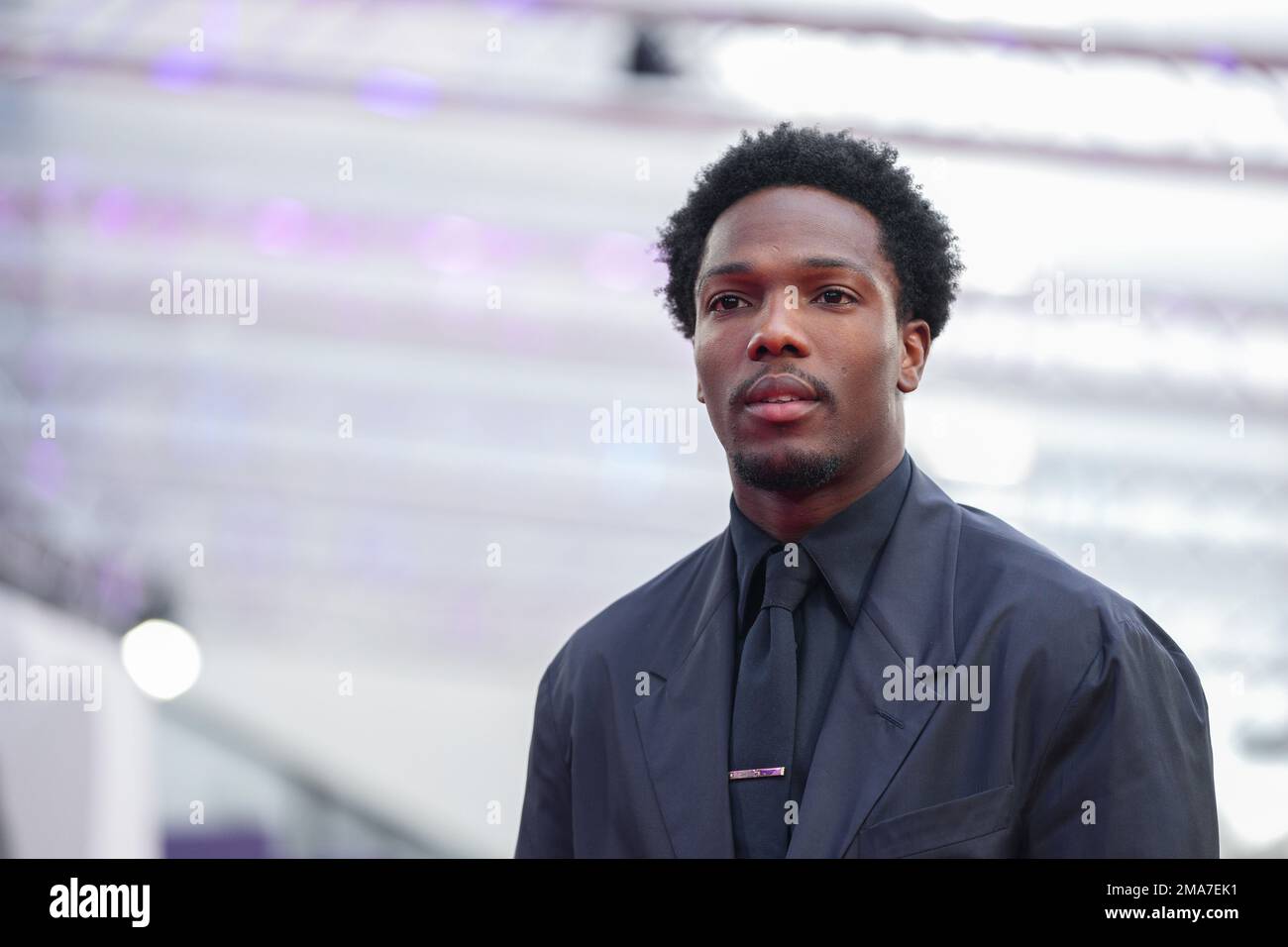 Tosin Cole poses for photographers upon arrival for the premiere of the ...