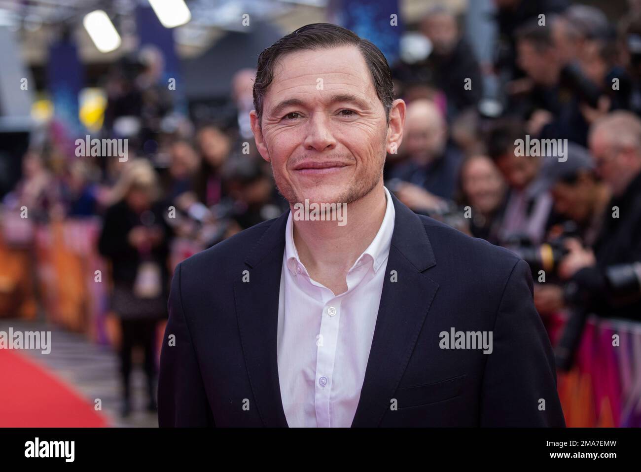 Burn Gorman poses for photographers upon arrival for the premiere of ...