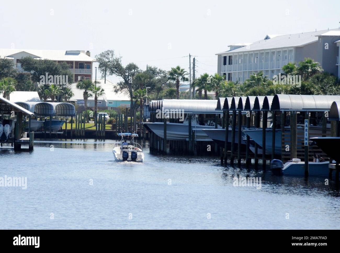 A boat cruises through a marina in rebuilt Mexico Beach, Fla., Tuesday ...