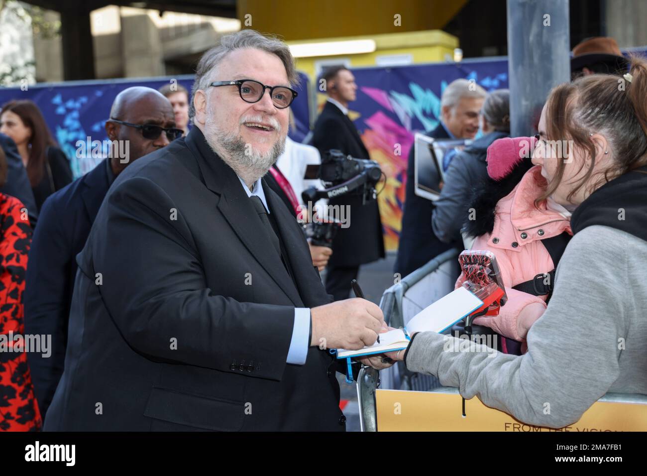Director Guillermo del Toro signs autographs upon arrival for the ...
