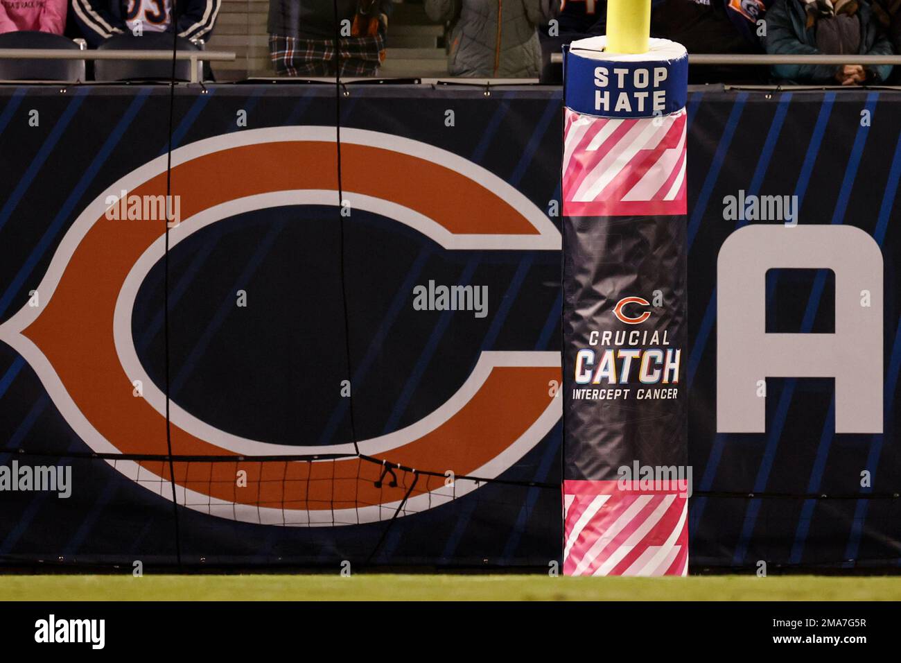 A Crucial Catch sign sits on the goal post during the first half of an ...
