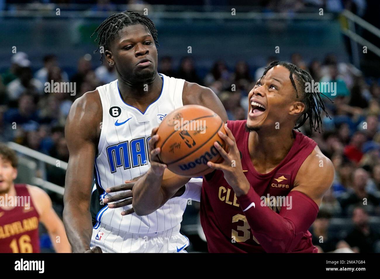 Cleveland Cavaliers' Isaac Okoro, right, drives to the basket against ...