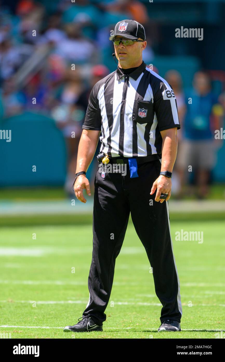 NFL umpire Mike Morton stands on the field during an NFL football game ...