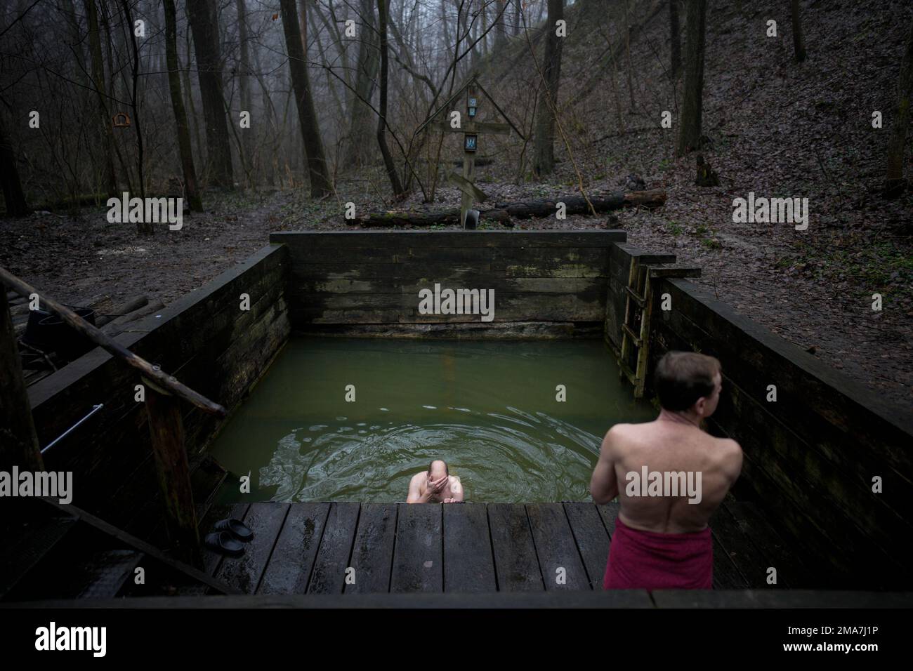A man bathes in the Dnieper river during orthodox epiphany celebrations ...