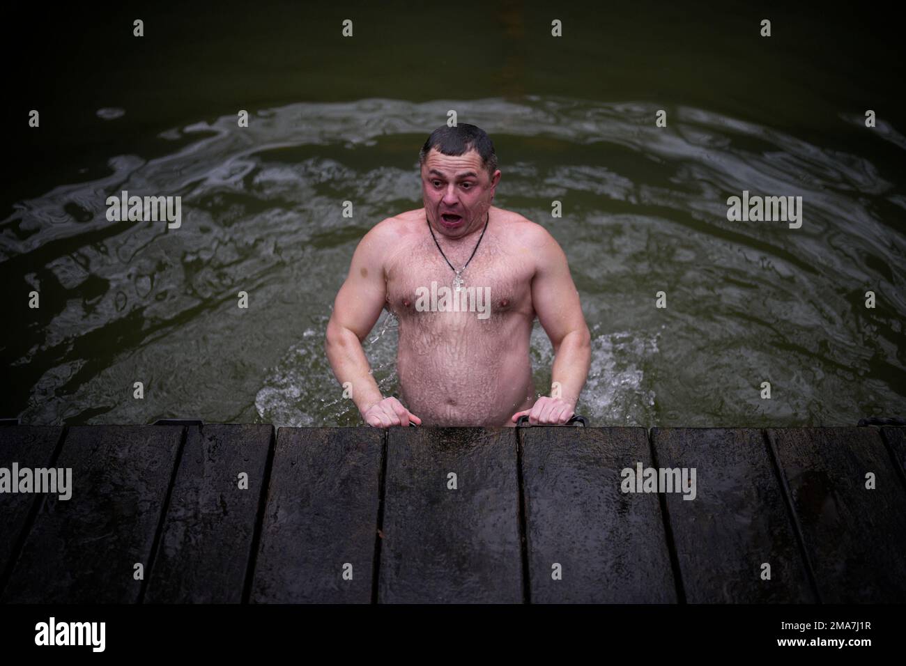 A man bathes in the Dnieper river during orthodox epiphany celebrations ...
