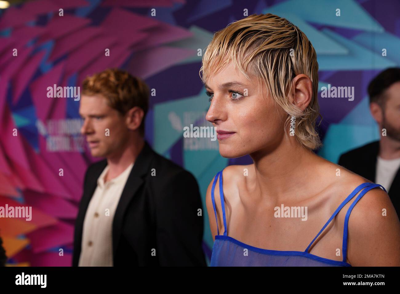 Emma Corrin, right, and Jack O'Connell are interviewed upon arrival for ...