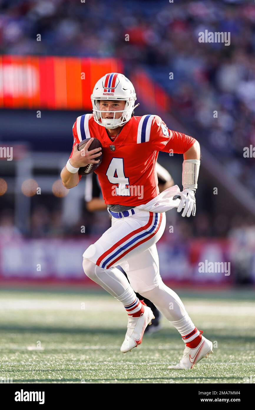 New England Patriots quarterback Bailey Zappe runs against the Detroit ...