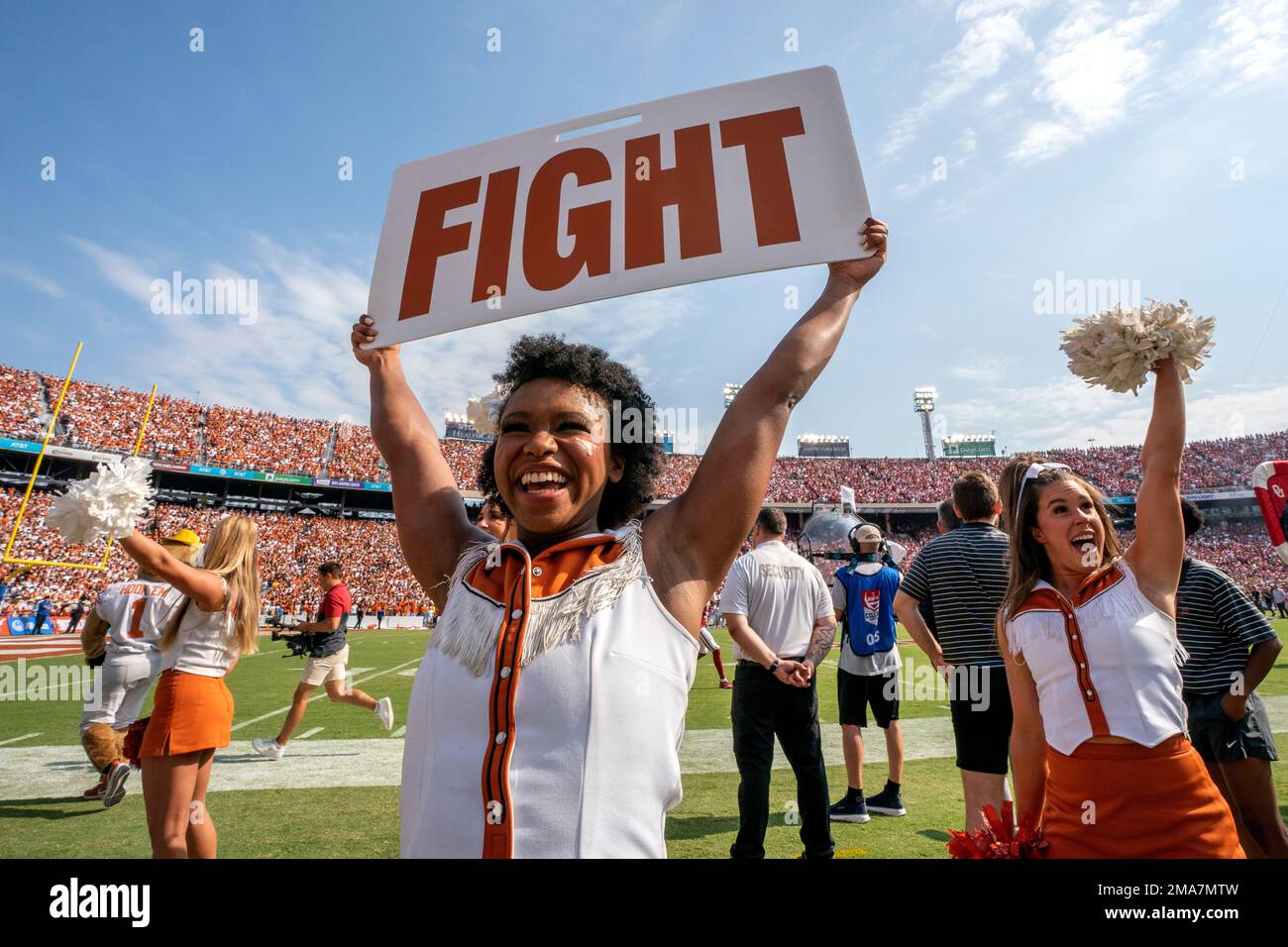 A Texas cheerleader cheers before an NCAA college football game against ...