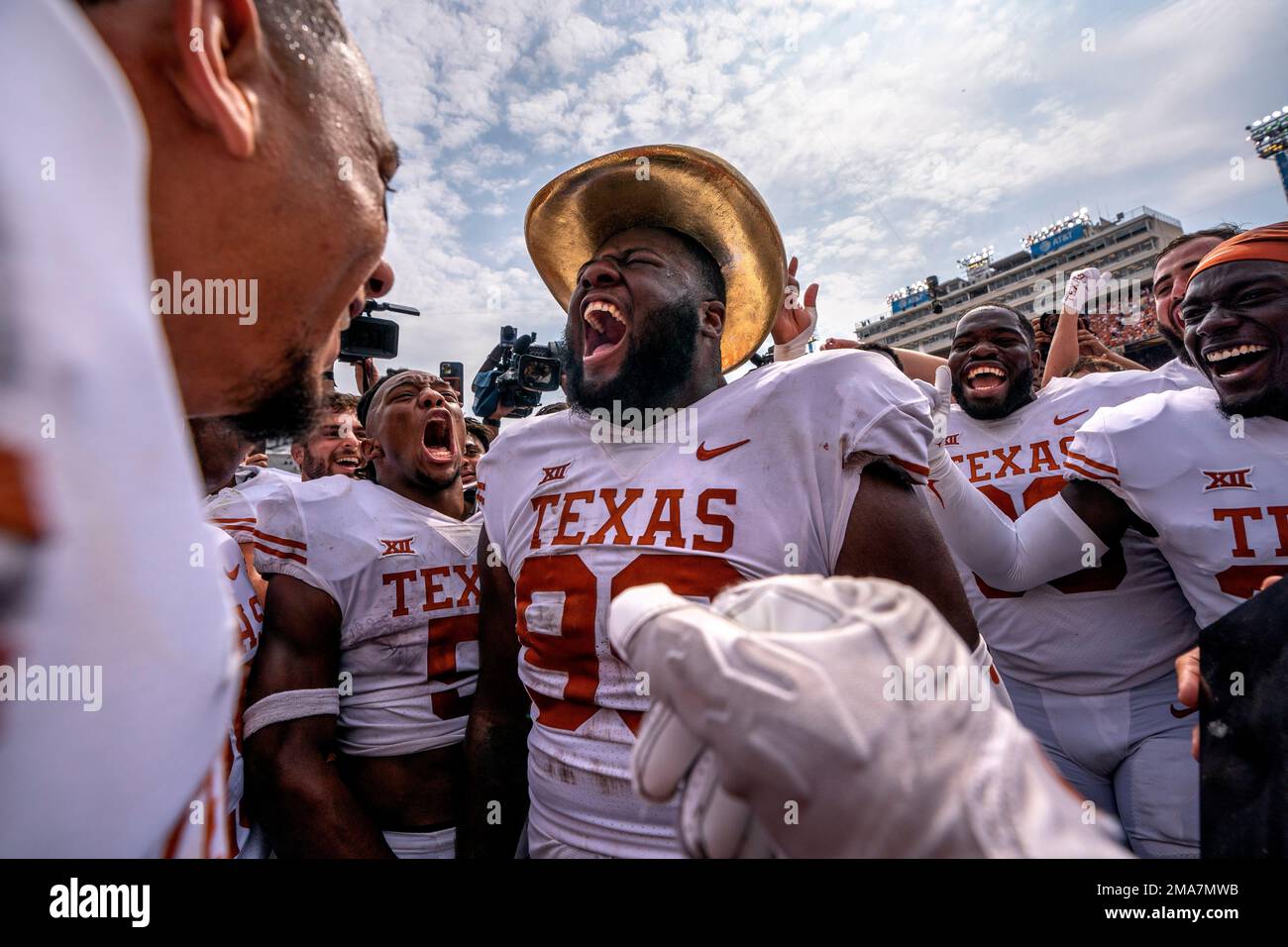 Texas defensive lineman Keondre Coburn (99) celebrates while wearing ...