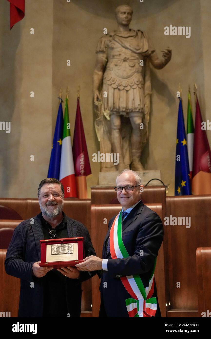 Actor Russel Crowe, left, poses under a statue of ancient Roman emperor ...
