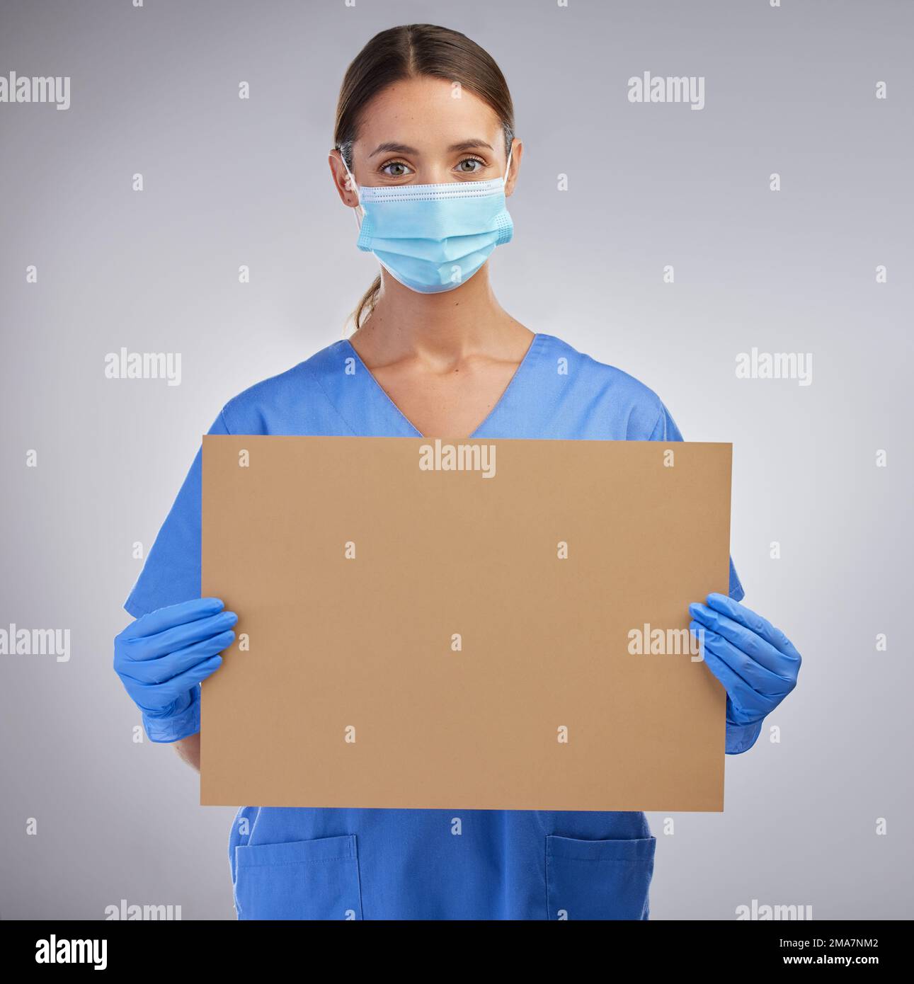 We need all the support we can get. a female nurse holding a board for ...