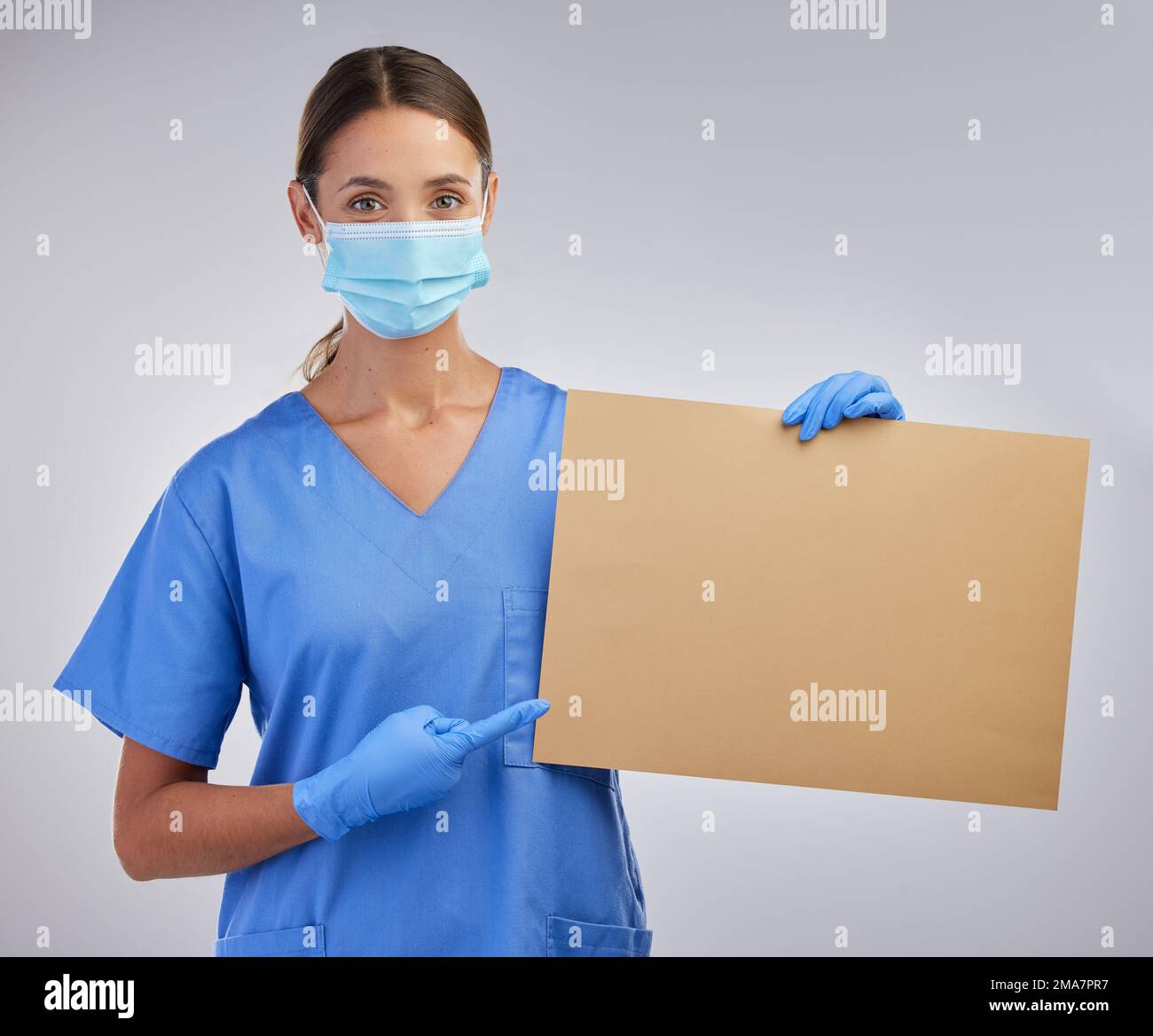Its important to support medical staff. a female nurse holding a board ...