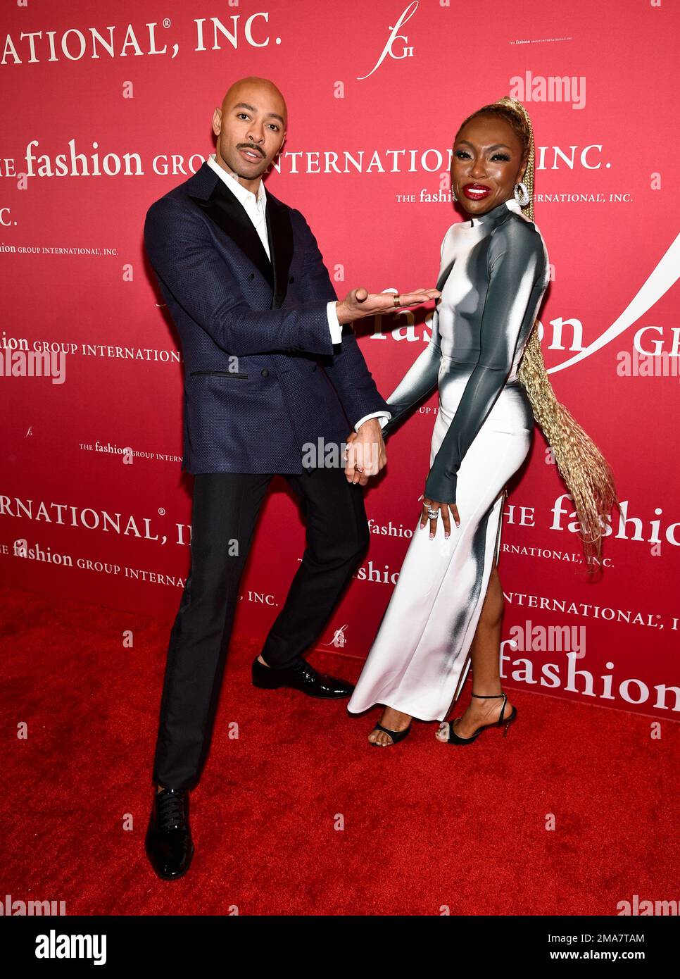 Honorees Sir John, left, and Sharon Chuter from Uomo Beauty attend the ...