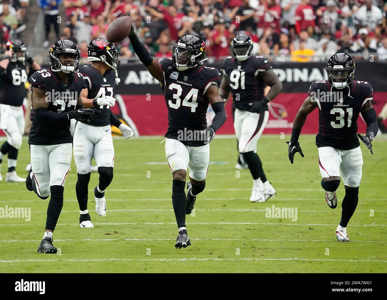 Arizona Cardinals' Antonio Hamilton (33), Ezekiel Turner (47) Jalen ...
