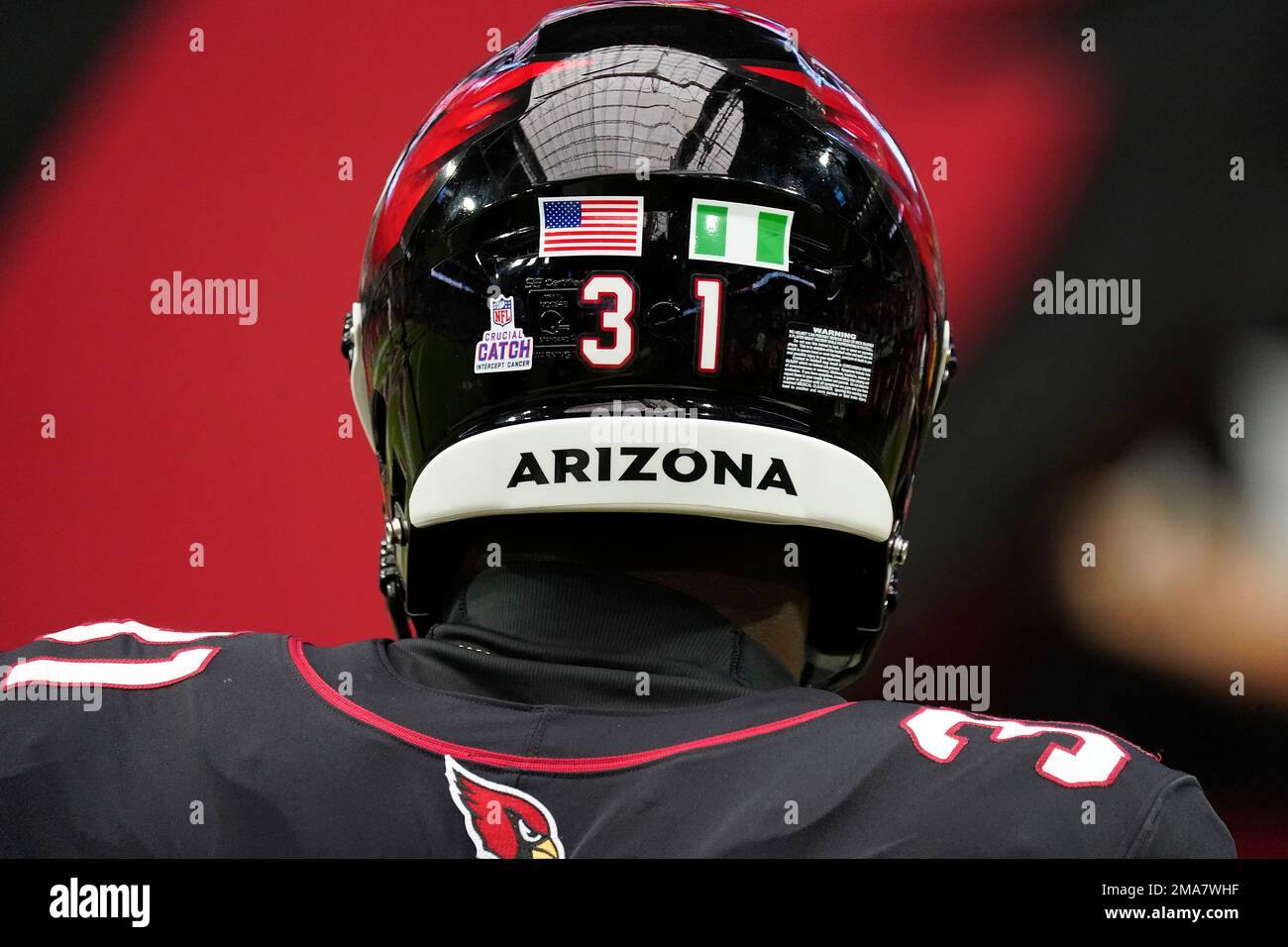 Arizona Cardinals' Chris Banjo wears an International flag on his ...
