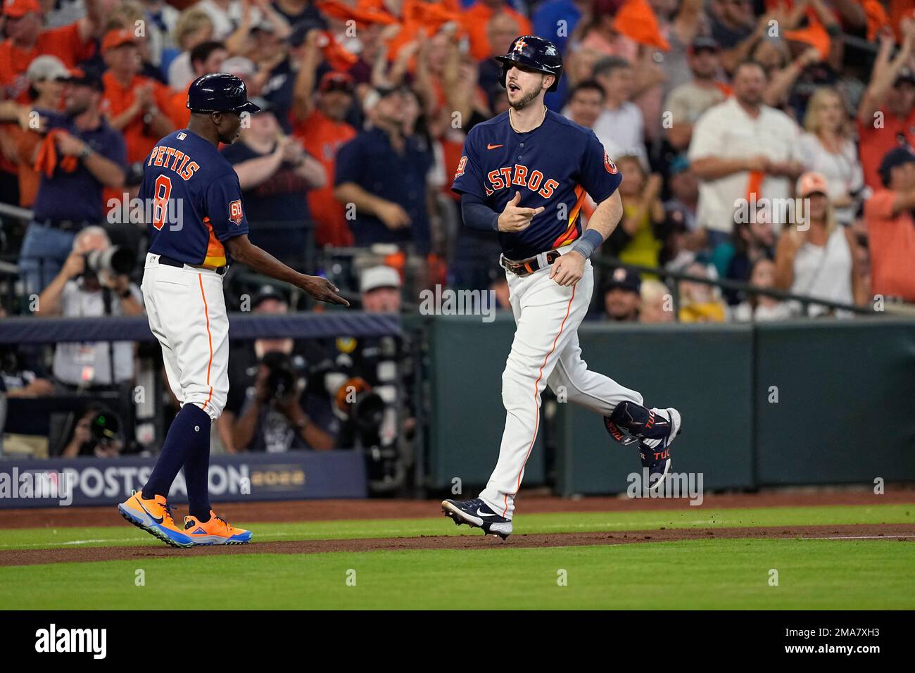 Houston Astros right fielder Kyle Tucker, right, rounds the bases after hitting a solo home run ...