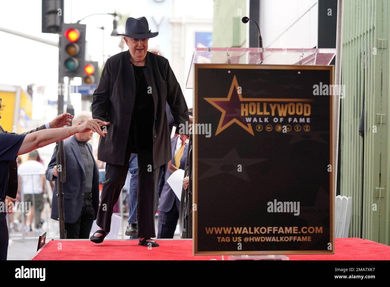 Grace Slick, of the band Jefferson Airplane, walks to the podium to ...