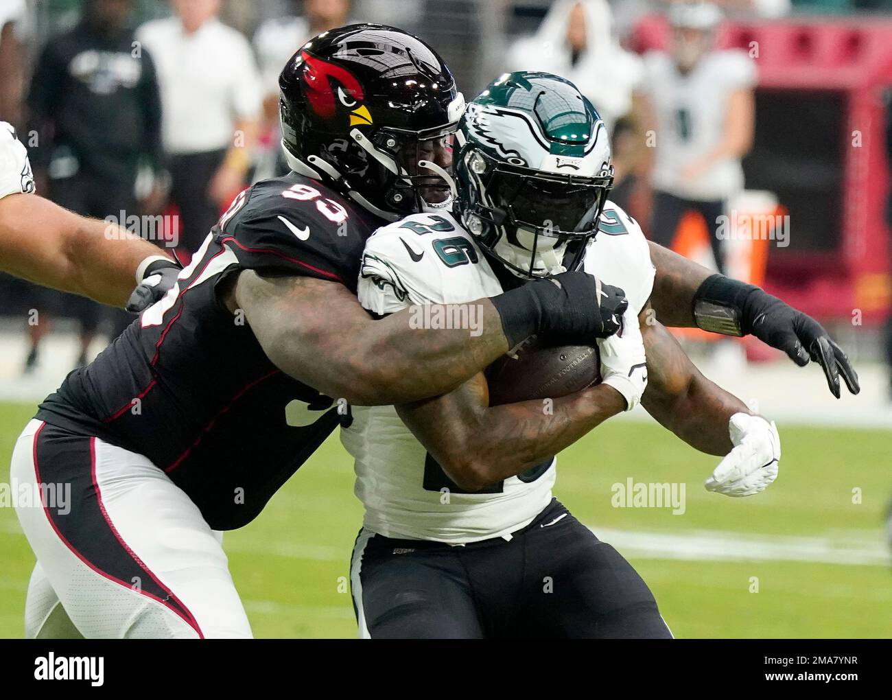Philadelphia Eagles' Miles Sanders (26) gets wrapped up by Arizona ...