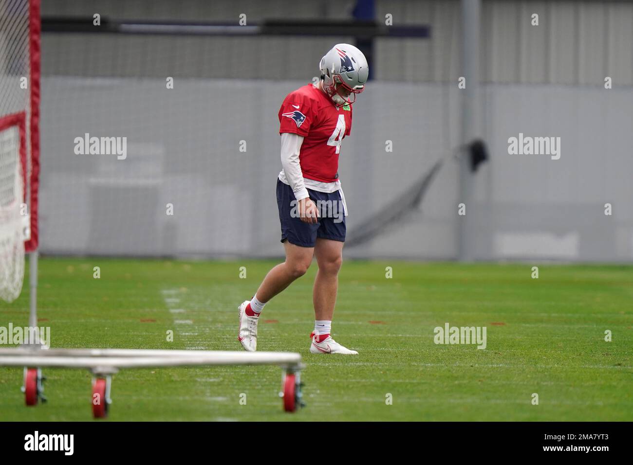 New England Patriots quarterback Bailey Zappe (4) walks on the field ...