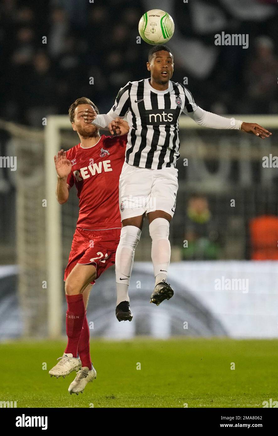 Partizan's Patrick Andrade goes for the header Cologne's Benno Schmitz during the Europa ...