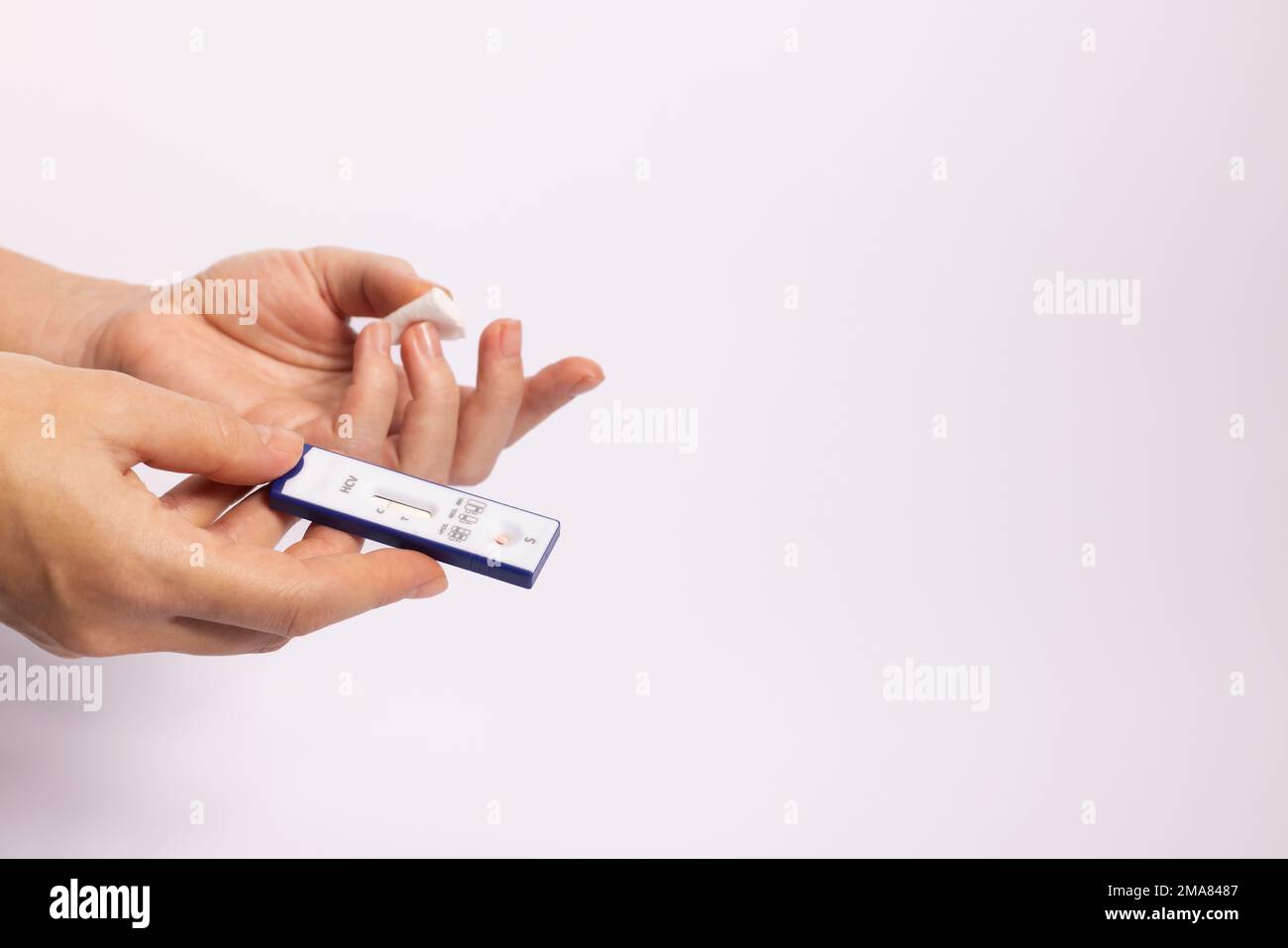 Hand holding rapid test for hepatitis. Negative test for hepatitis ...