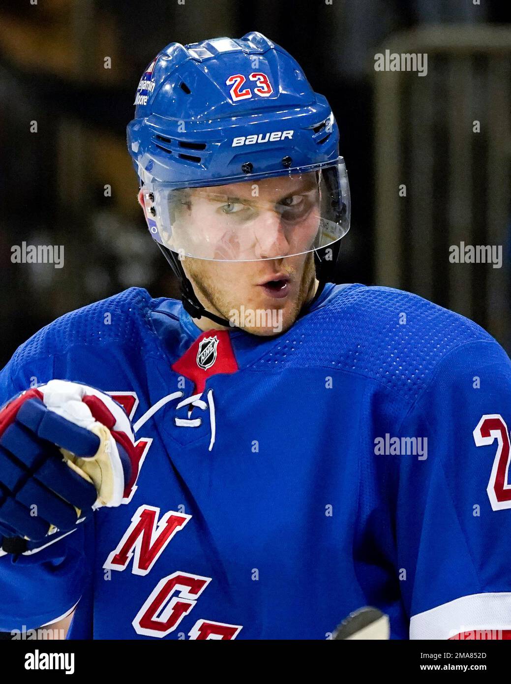 New York Rangers defenseman Adam Fox gestures to a teammate during an ...