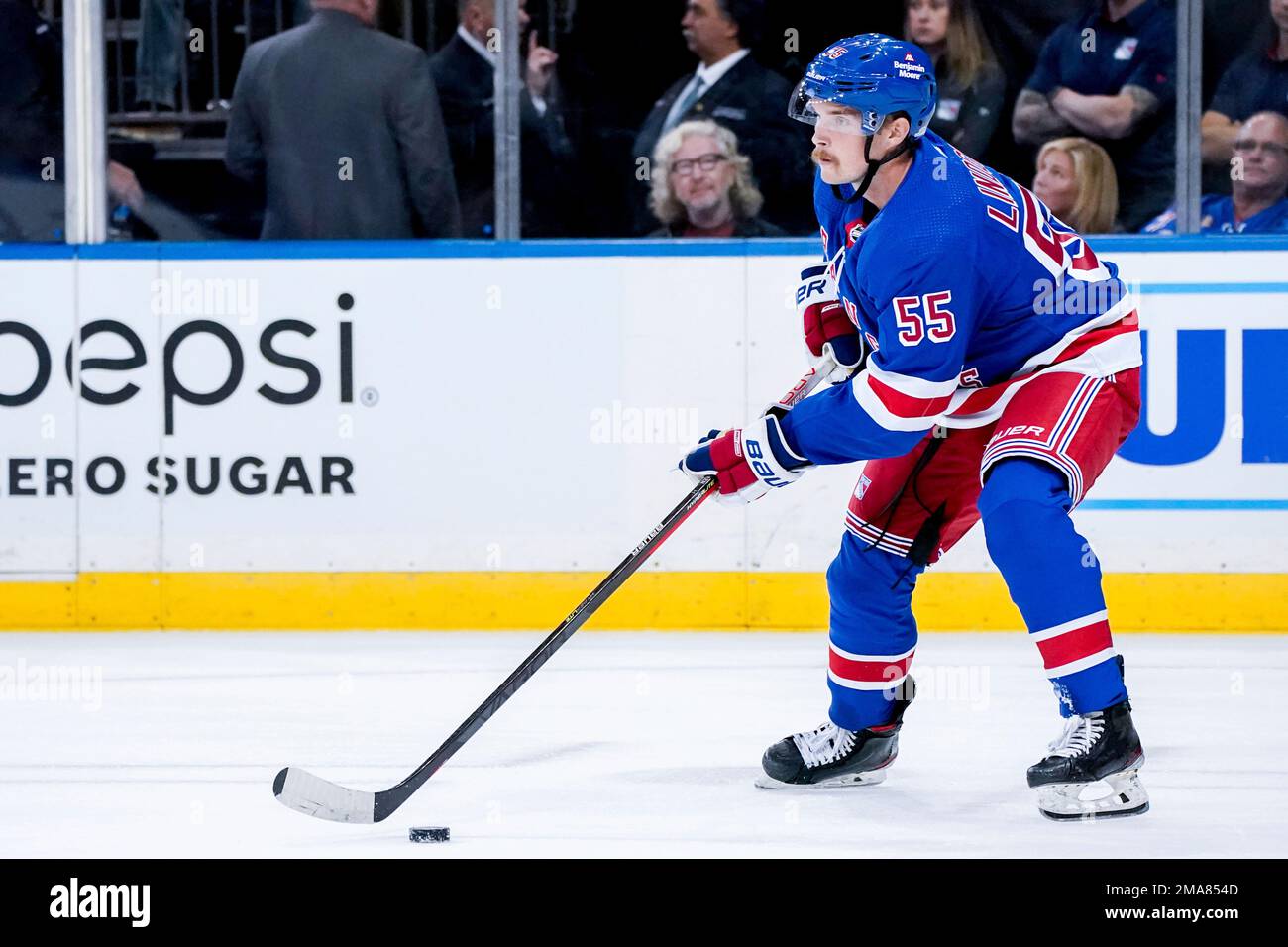 New York Rangers defenseman Ryan Lindgren skates with the puck during ...