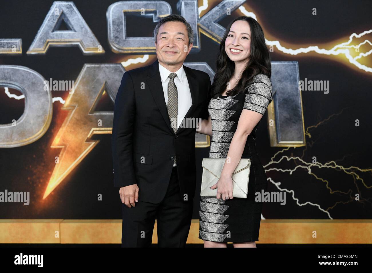 Publisher and chief creative officer of DC Comics Jim Lee, left, and daughter attend the world ...