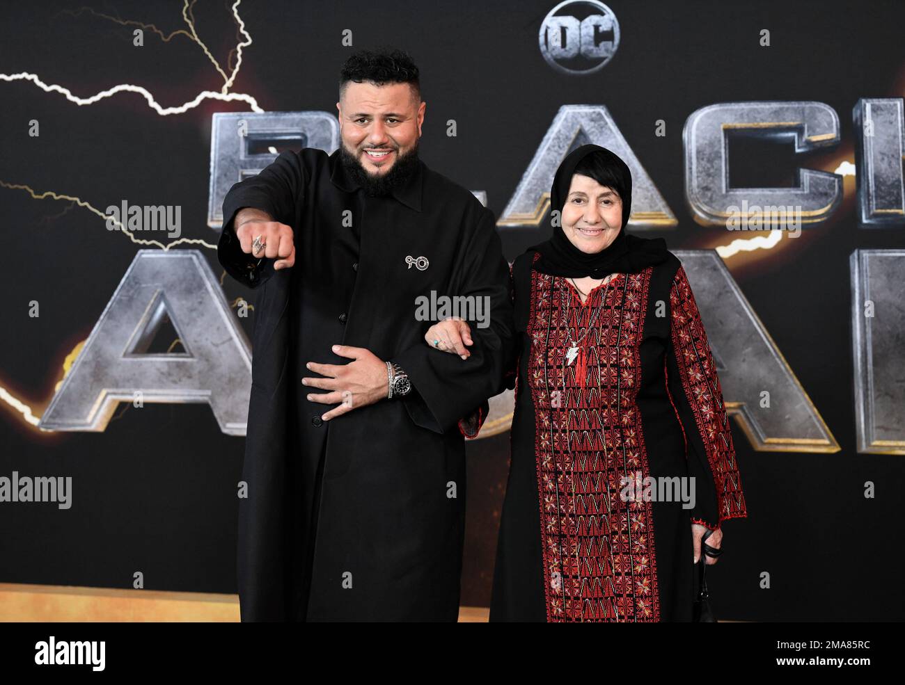 Mohammed Amer, left, and his mother attend the world premiere of "Black Adam" in Times Square on ...