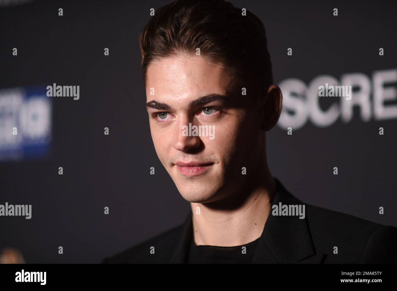 Hero Fiennes Tiffin arrives at a red carpet event for "The Loneliest ...