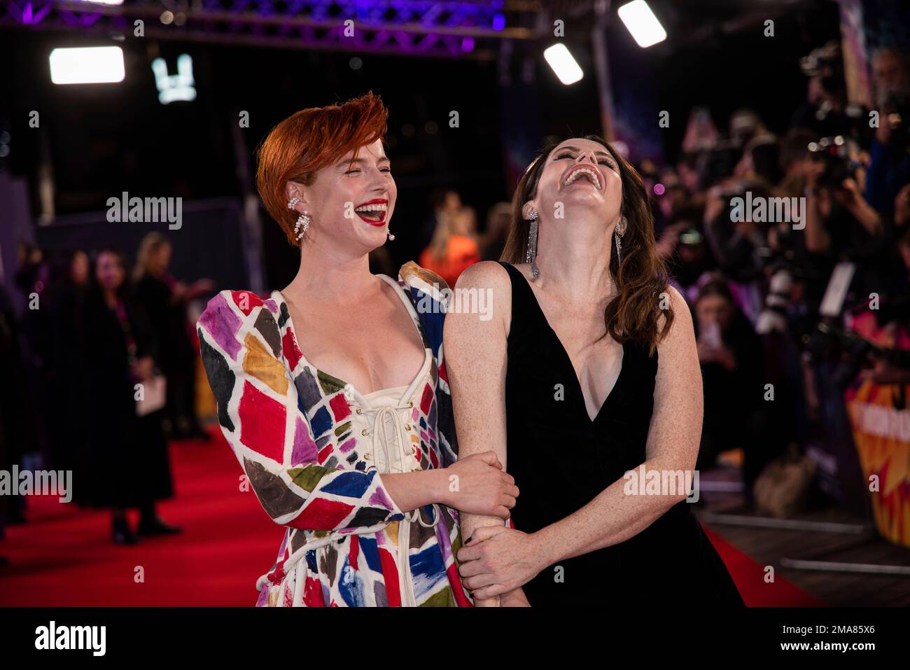 Claire Foy, right and Jessie Buckley pose for photographers upon ...