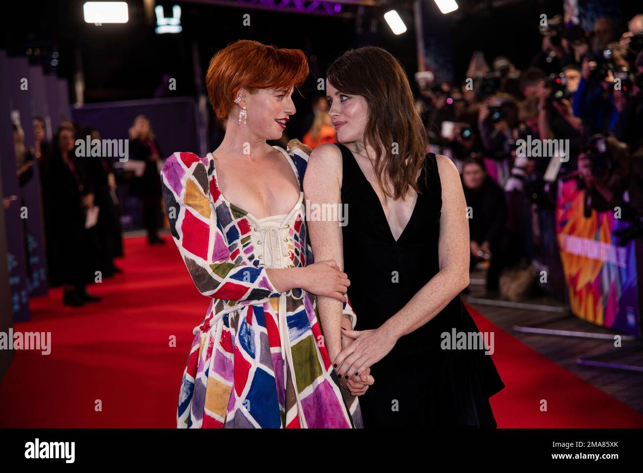 Claire Foy, right and Jessie Buckley pose for photographers upon ...