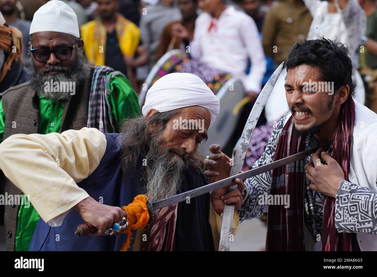 GRAPHIC CONTENT - An Indian ascetic Muslim puts a sharp object into his ...
