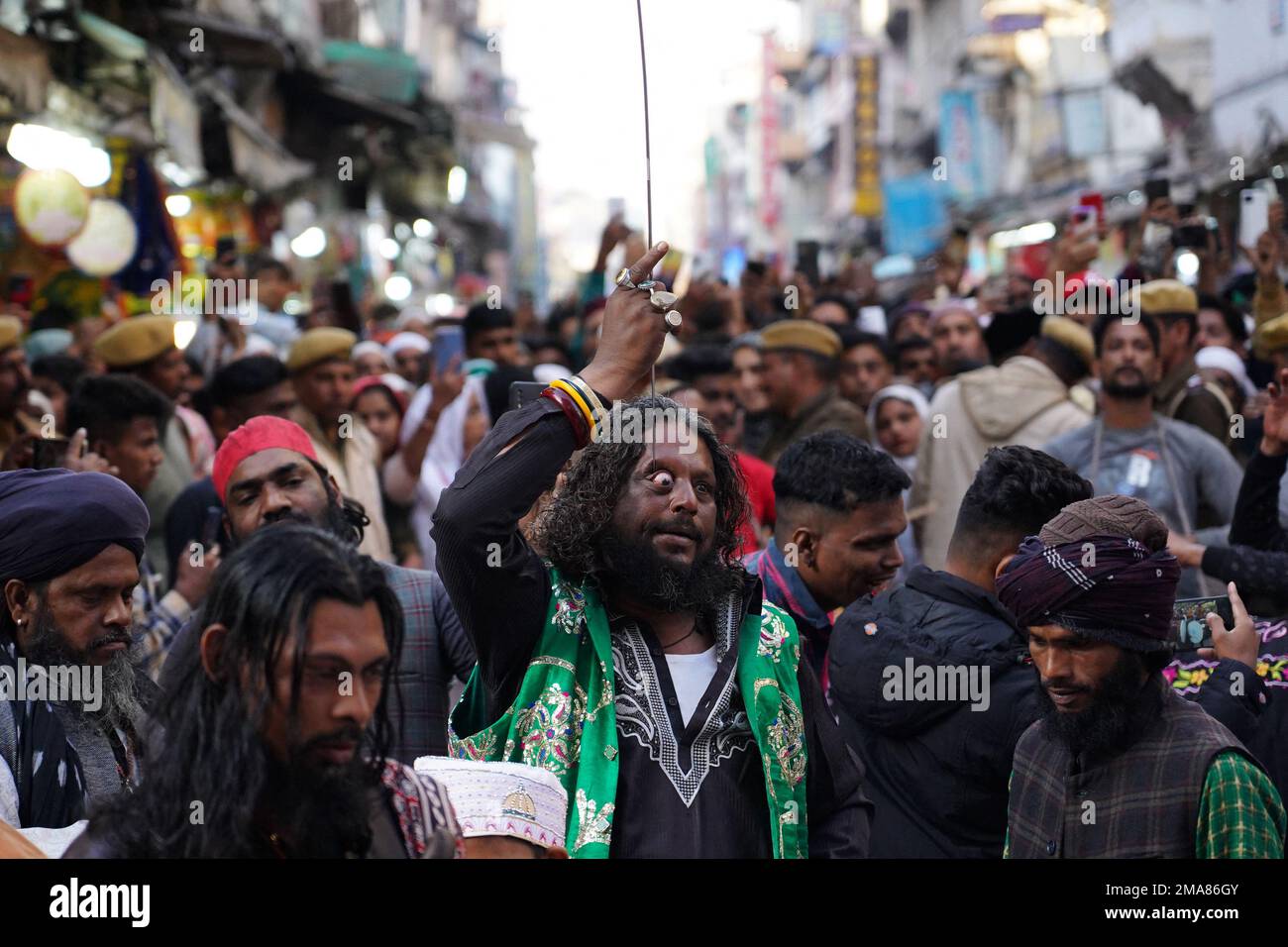 GRAPHIC CONTENT - An Indian ascetic Muslim puts a sharp object into his ...