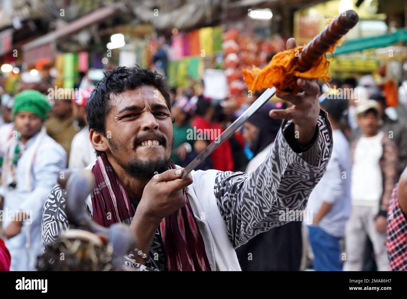 GRAPHIC CONTENT - An Indian ascetic Muslim puts a sharp object into his ...