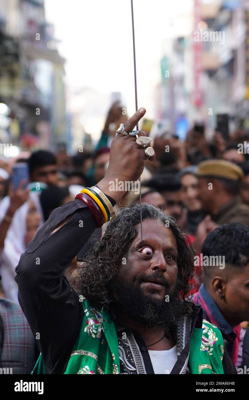 GRAPHIC CONTENT - An Indian ascetic Muslim puts a sharp object into his ...