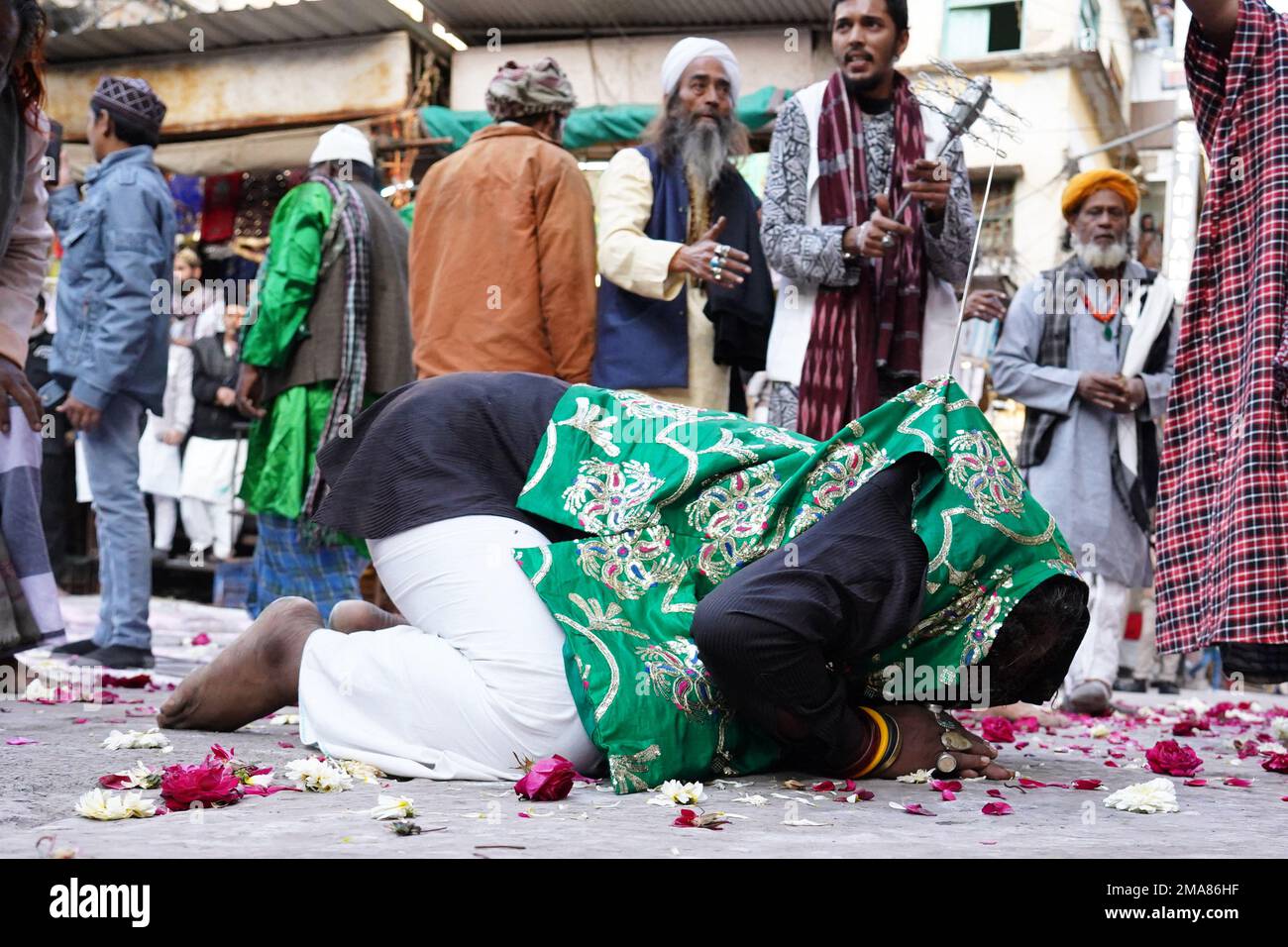 GRAPHIC CONTENT - An Indian ascetic Muslim puts a sharp object into his ...