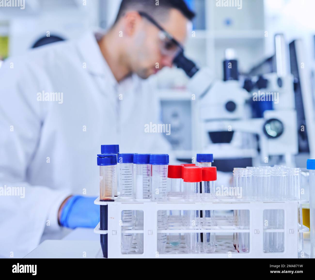 Time to get these vials filled. vials in a lab with an unrecognizable ...